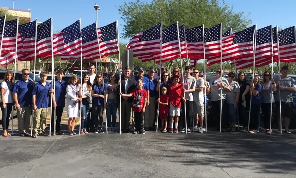 Hold Flags to Welcome Home Veterans - JustServe